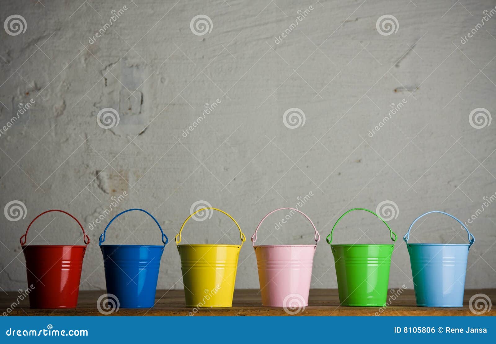Coloured Buckets in Line on the Floor Stock Photo - Image of steel ...