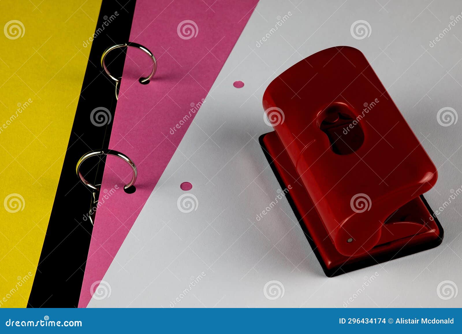 Coloured Card with Hole Punch and White Paper Sheet in an Open Ring ...
