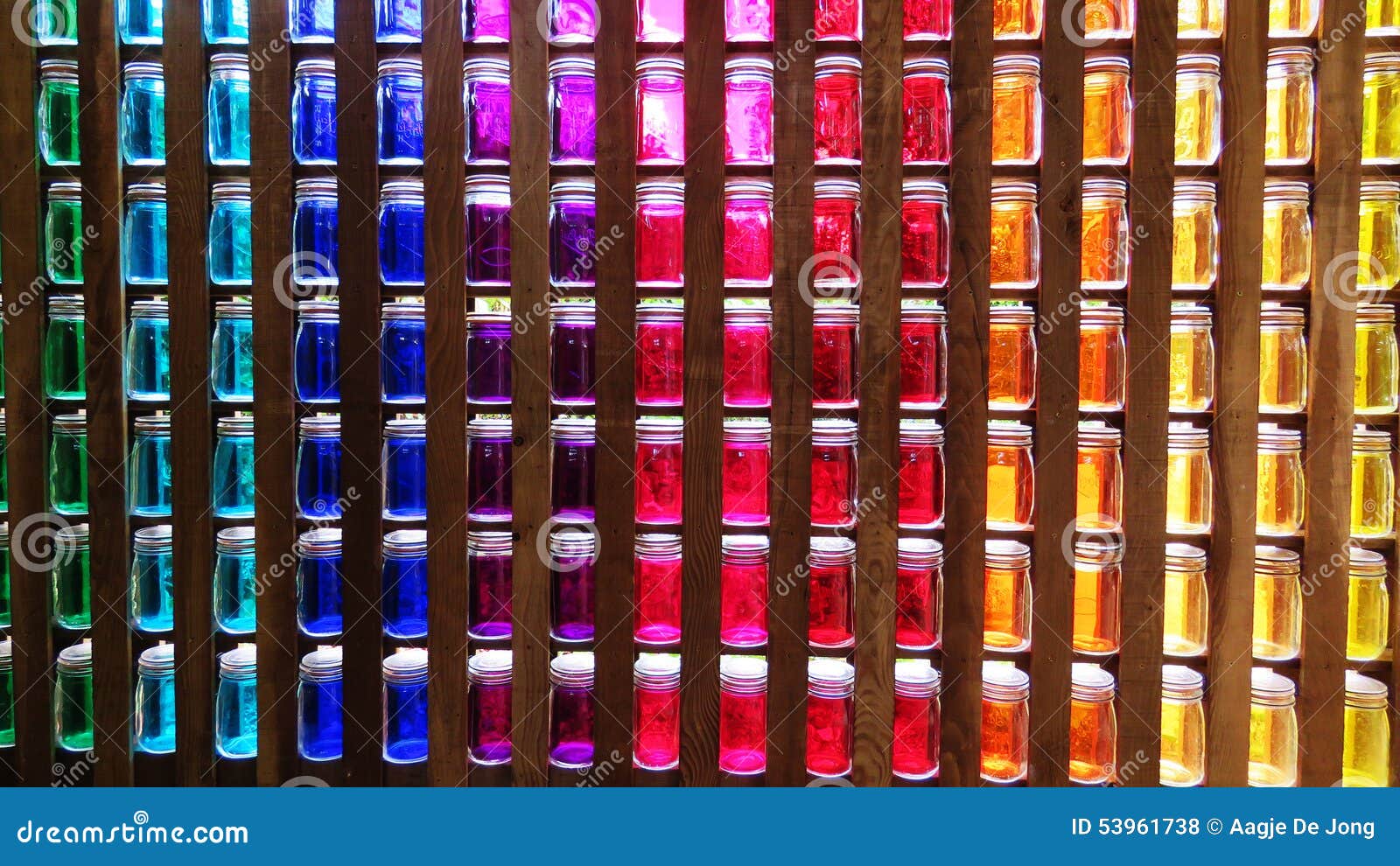 Coloured Glass Pots in a Wall Stock Photo - Image of wall, blue: 53961738
