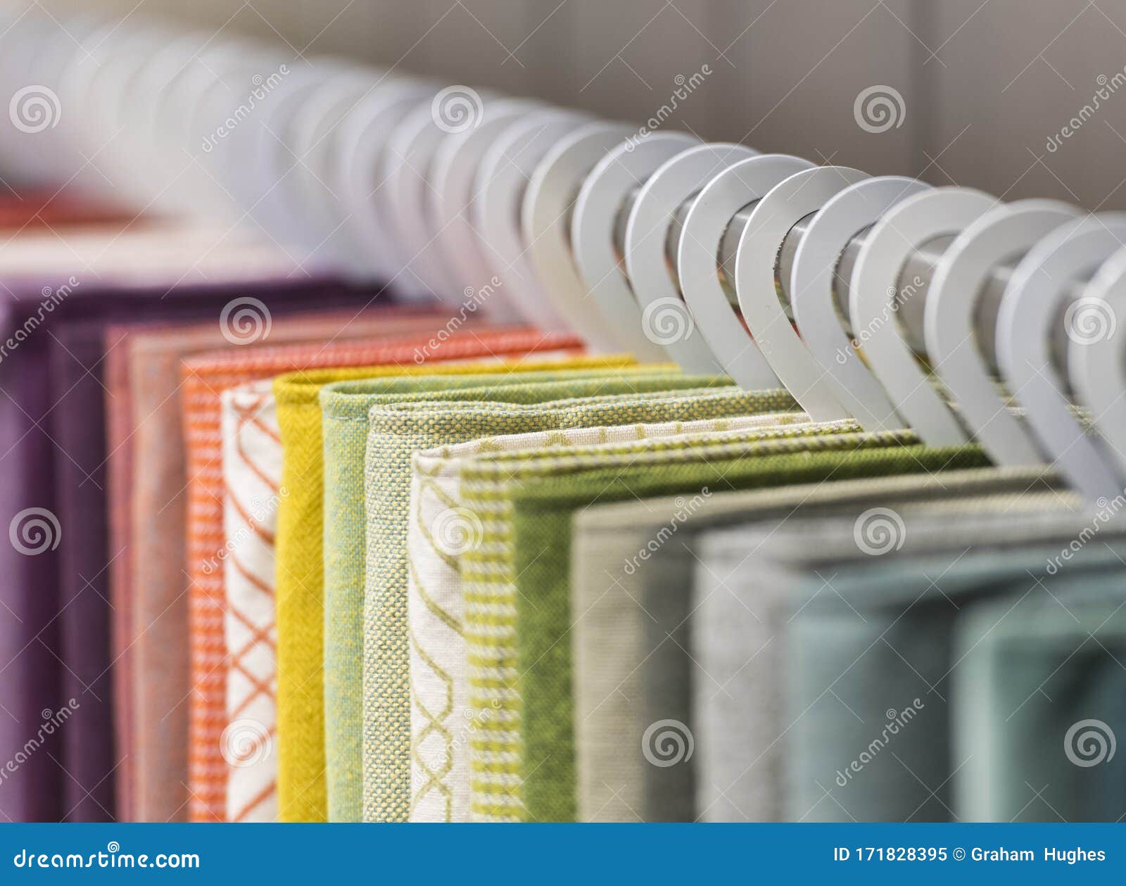 Coloured Patterned Textured Fabric on a Rack Stock Image - Image of ...