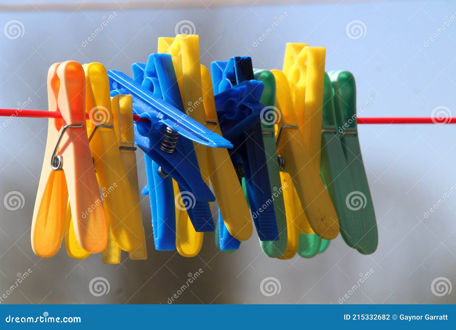 Coloured Pegs on a Washing Line Stock Photo - Image of coloured, blue ...