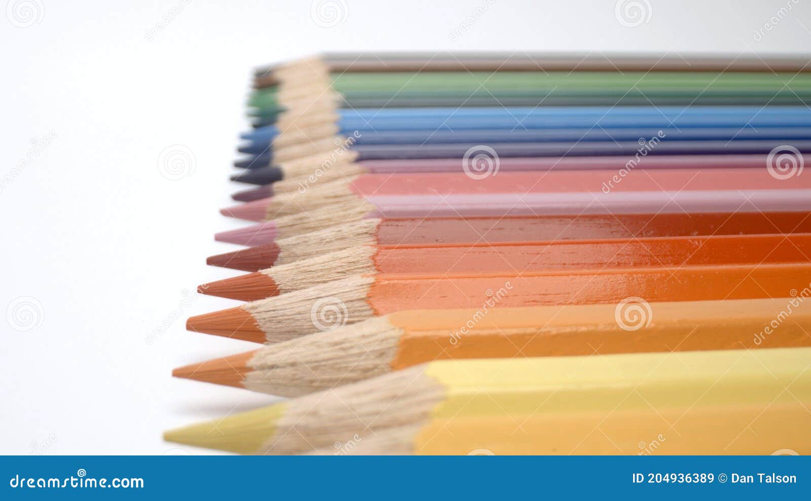 Coloured pencils in a row stock image. Image of obsession - 204936389