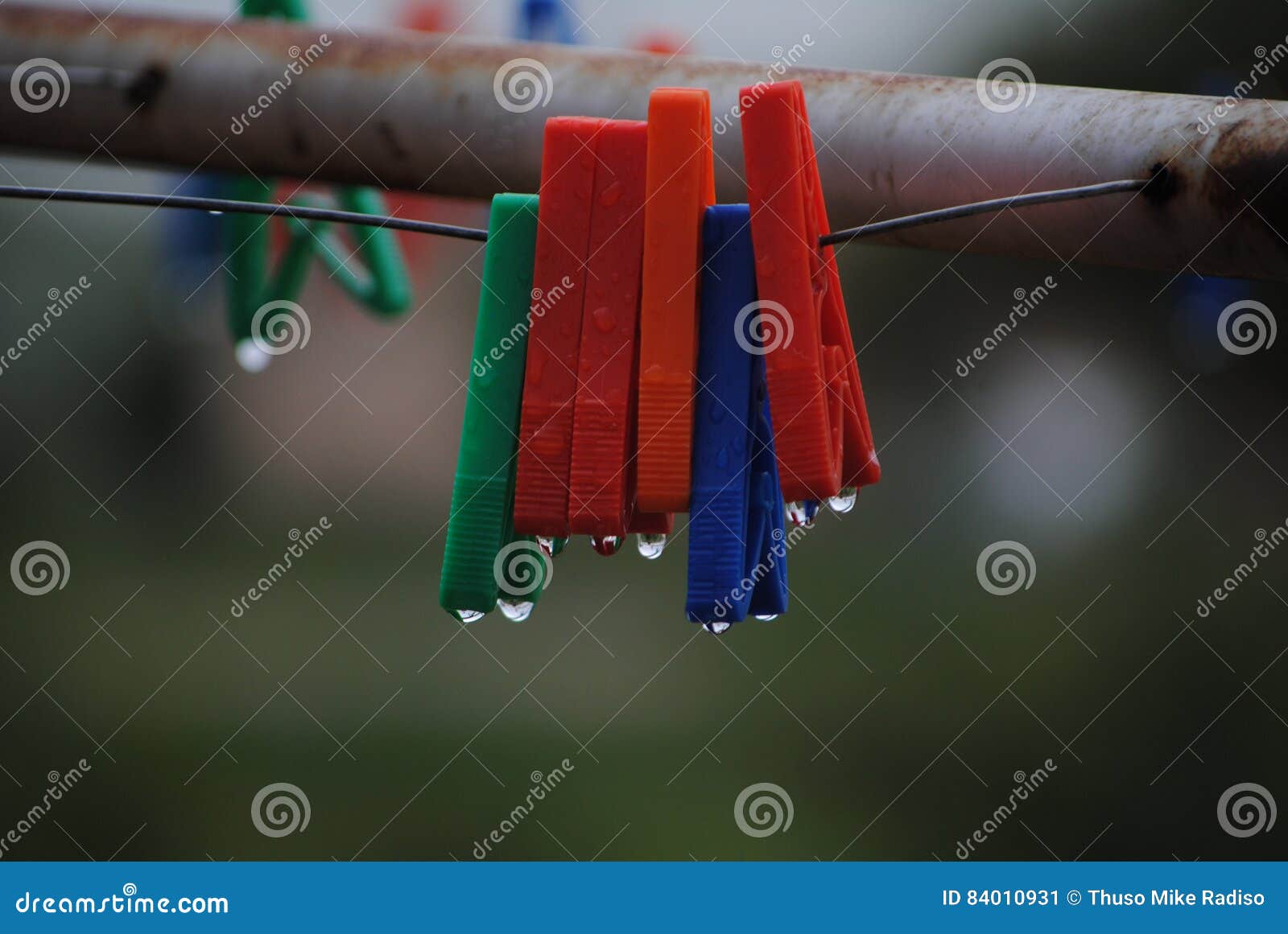 Coloured Plastic Pegs on a Washing Line Stock Image - Image of green ...