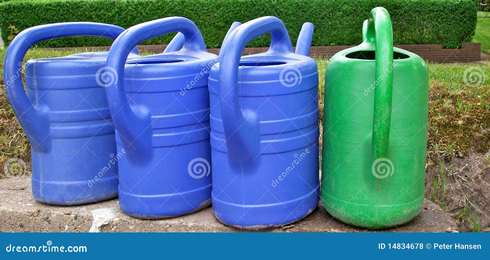 Coloured watering cans stock photo. Image of plastic - 14834678
