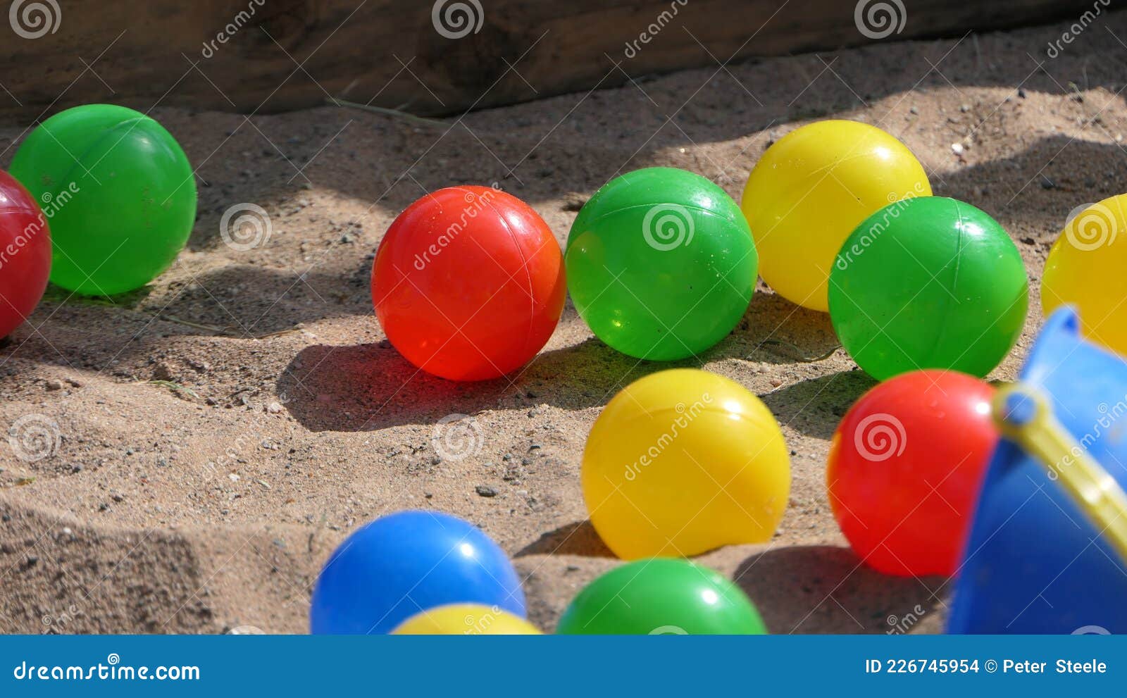 Colourful Balls Buckets and Spades in Childs Sand Pit Stock Photo ...