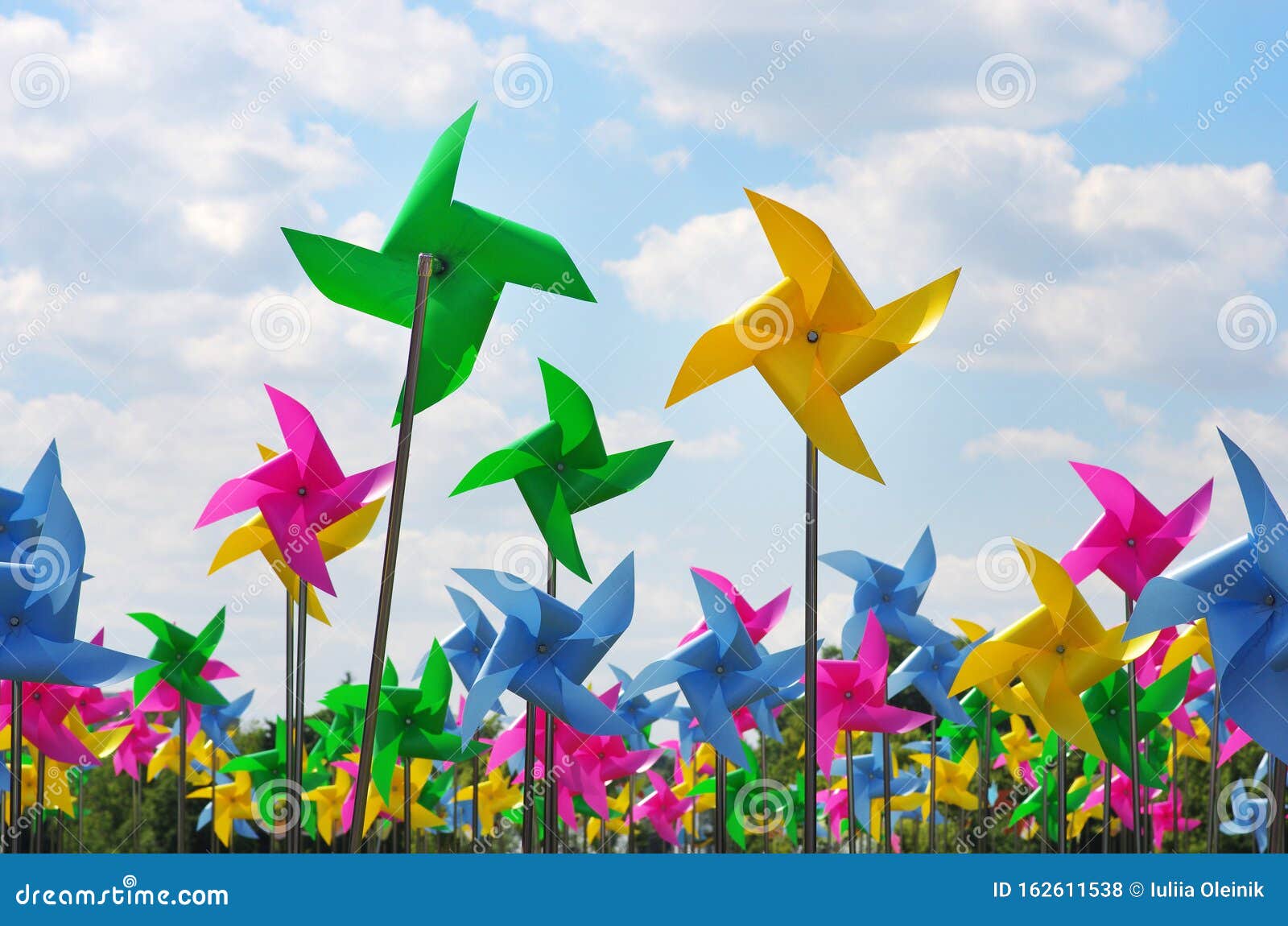 Colourful Children`s Pinwheels in the Blue Sky Stock Photo - Image of ...