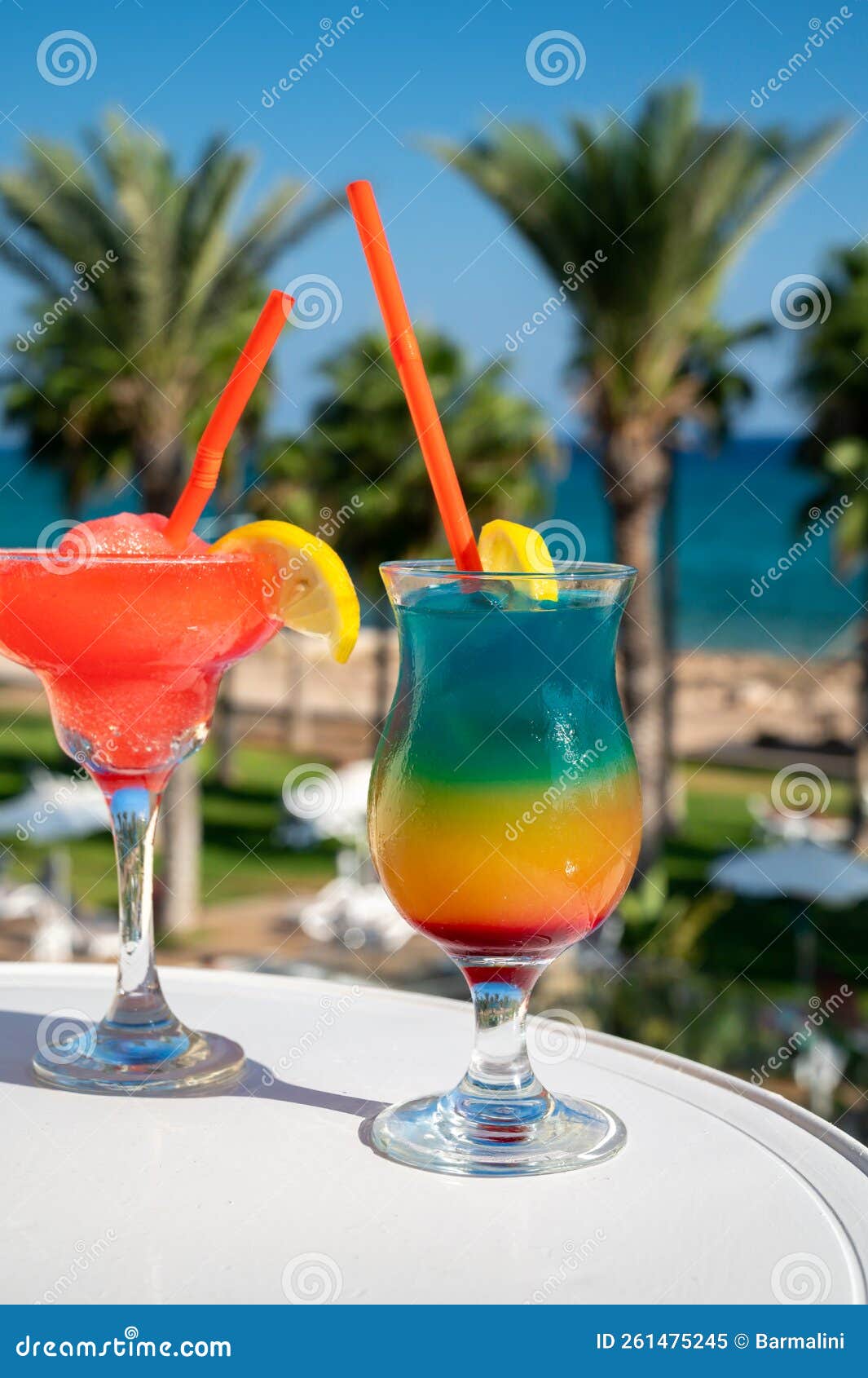 Colourful Cold Strawberry Daiquiri And Rainbow Paradise Cocktails