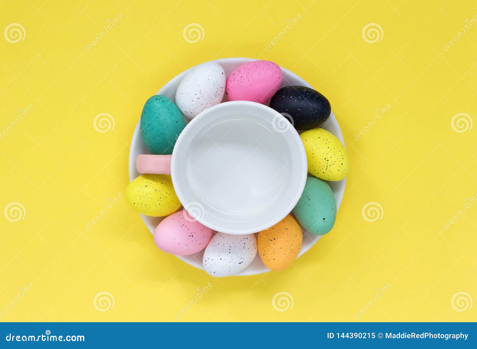Colourful Easter Eggs Around a Tea Cup, on a Yellow Background Stock ...