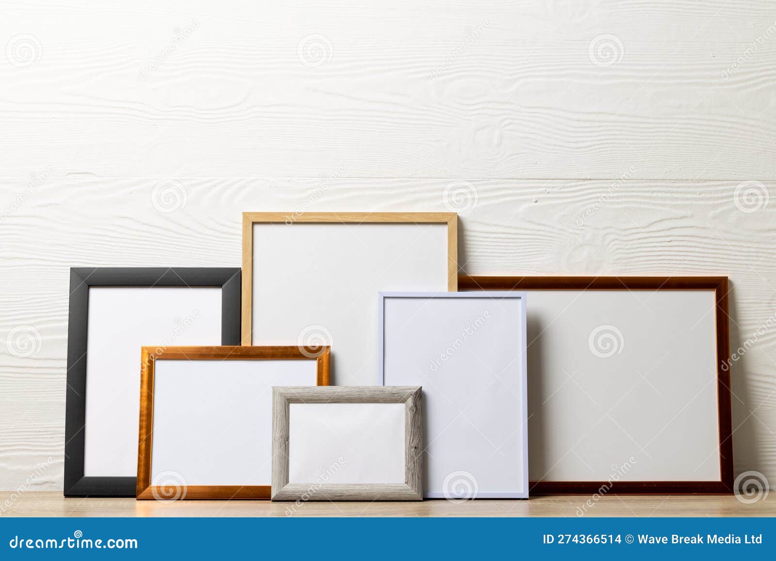 Colourful Empty Frames with Copy Space on Table Against White Wall ...