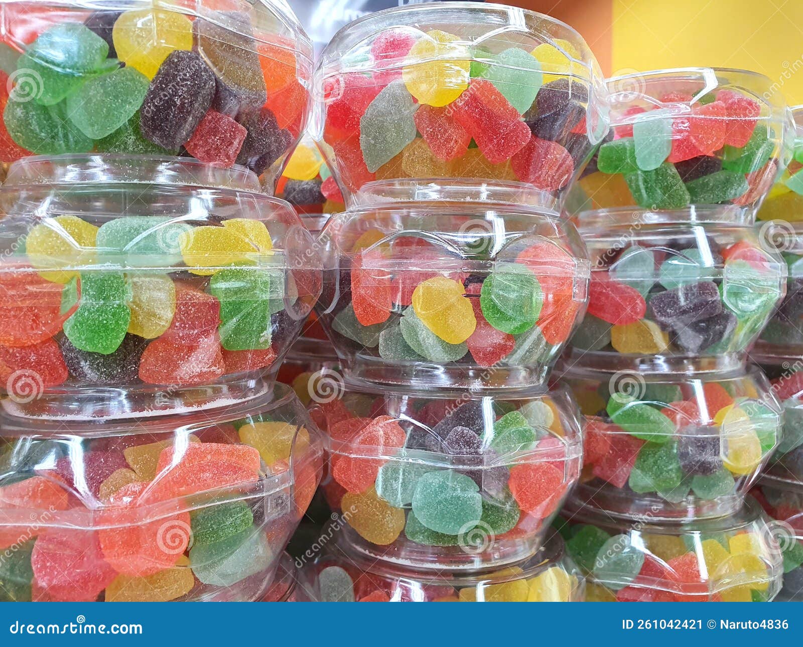 Fruit candy in plastic box stock image. Image of purple - 261042421