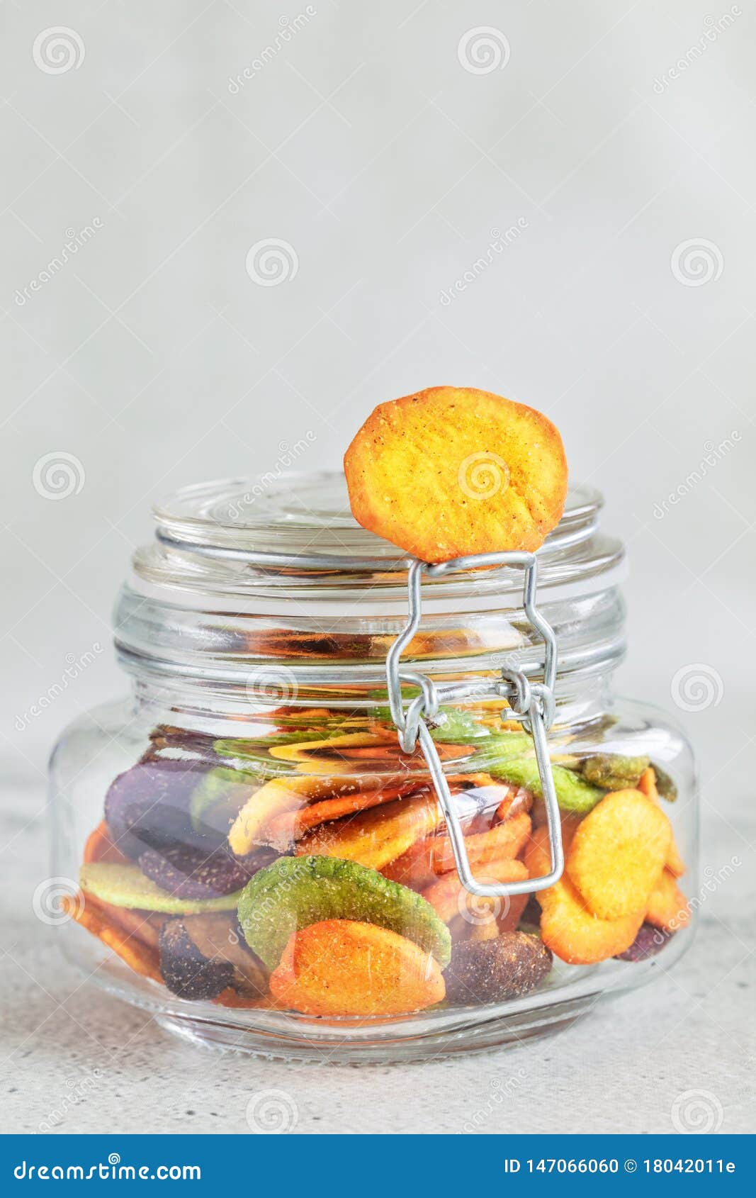 Colourful Mix Vegetable Chips in Glass Jar, Vertical Composition Stock ...