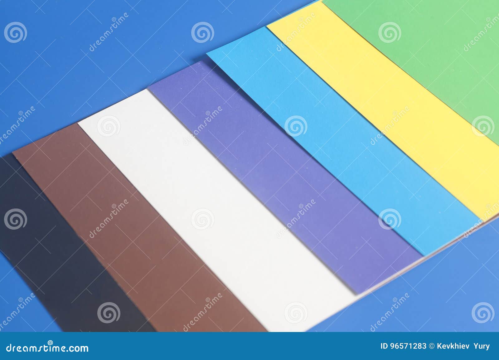 Colourful Paper Sheets on Blue Stock Image - Image of diversity ...