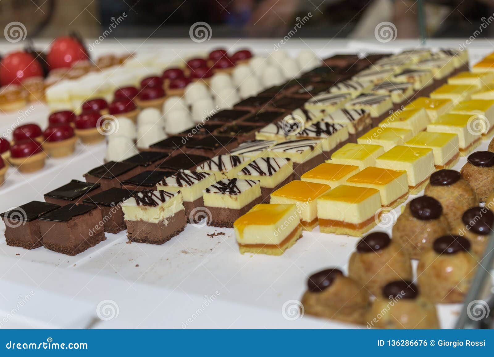 Colourful Pastries and Biscuits Inside a Display Case in a Pastry Shop ...