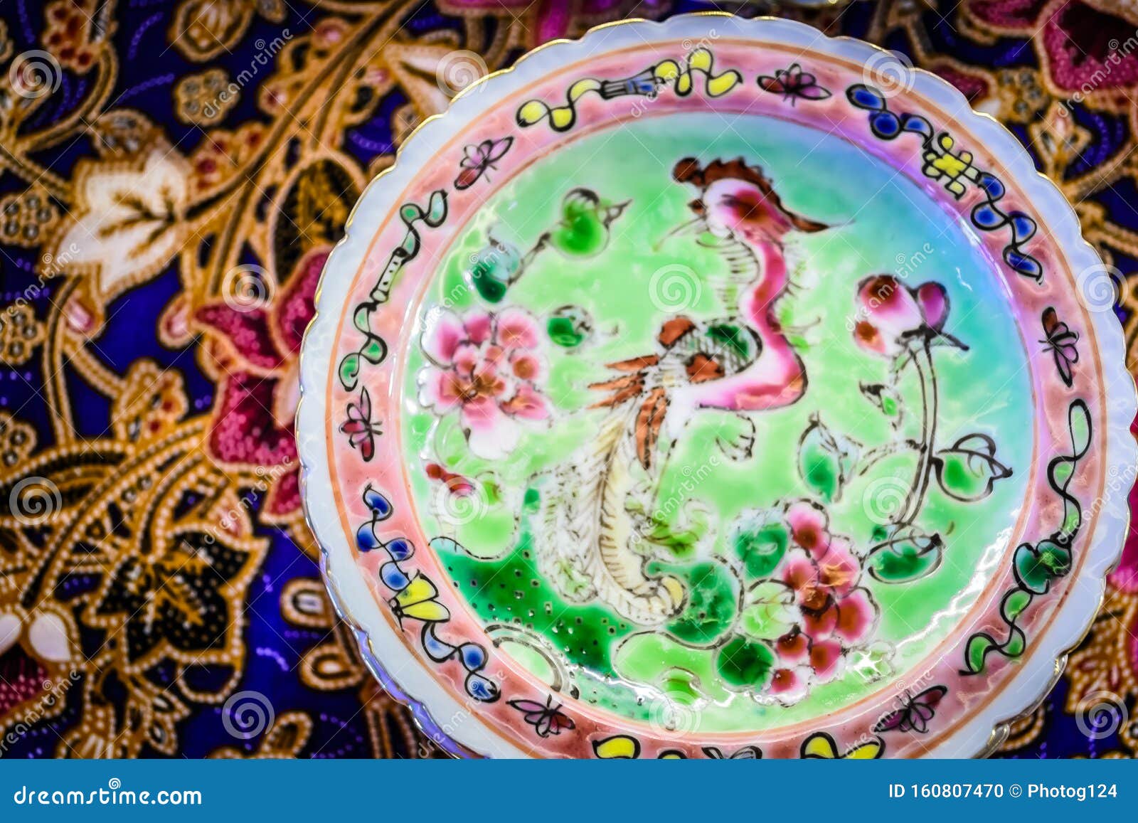 Colourful Peranakan Small Dishes on a Colourful Batik Table Cloth with ...