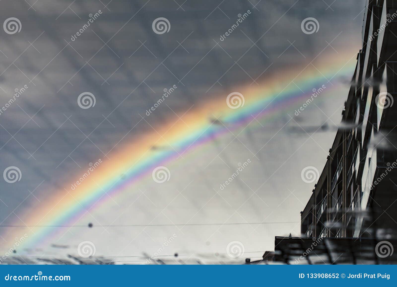 Rainbow Reflected on a Puddle Stock Photo - Image of colourful, puddle ...