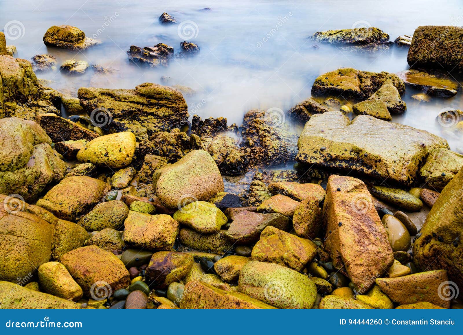 Colourful rocks and water stock photo. Image of head - 94444260