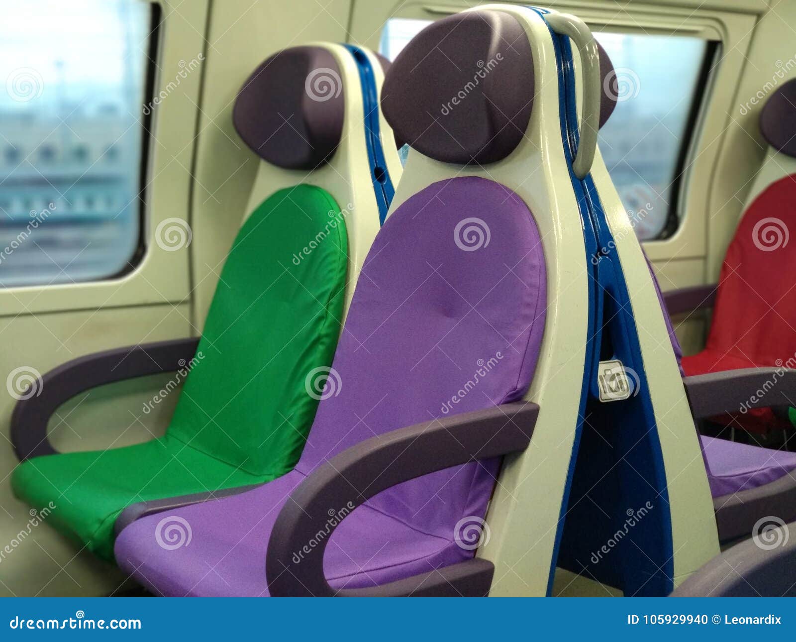Colourful seats on a train stock photo. Image of train - 105929940