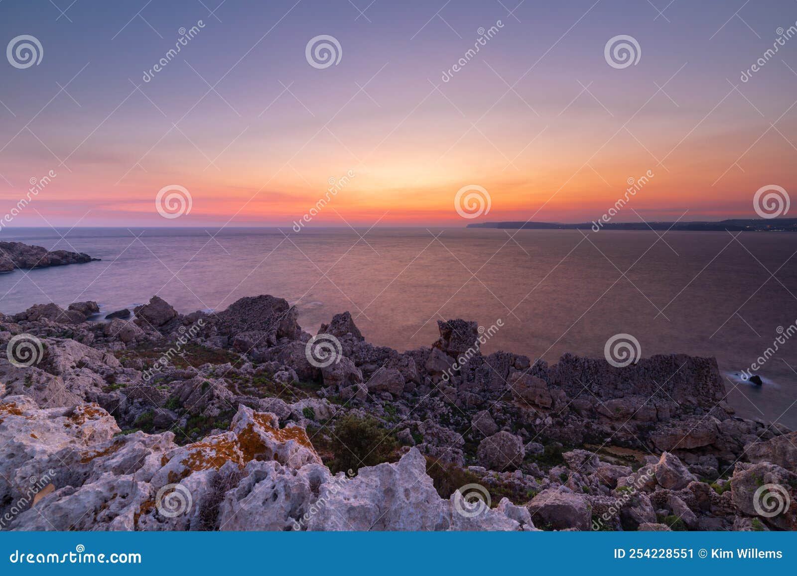 A Colourful Sunset Over the Cliffs of Paradis Bay in Malta with a View ...