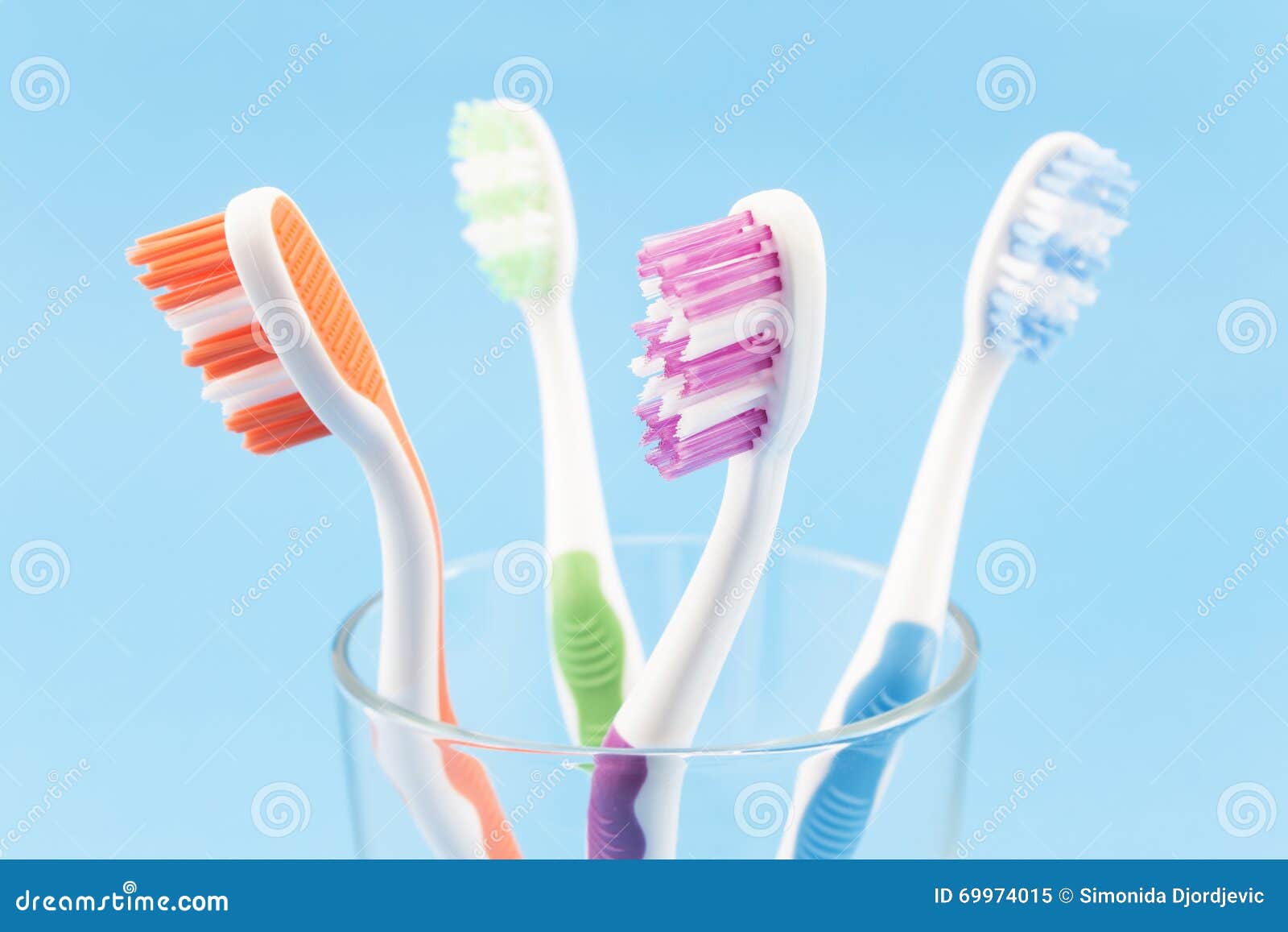 Colourful Toothbrushes Isolated on Blue Stock Image - Image of ...