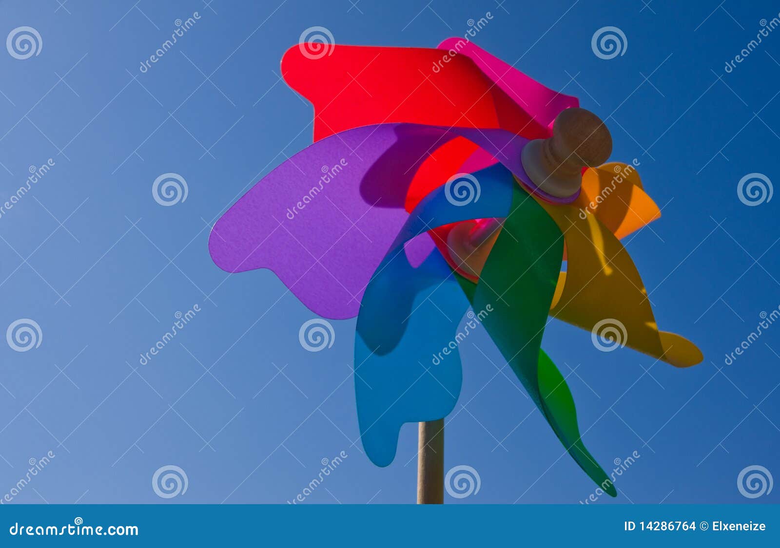 Colourful wind wheel stock photo. Image of playing, clear - 14286764