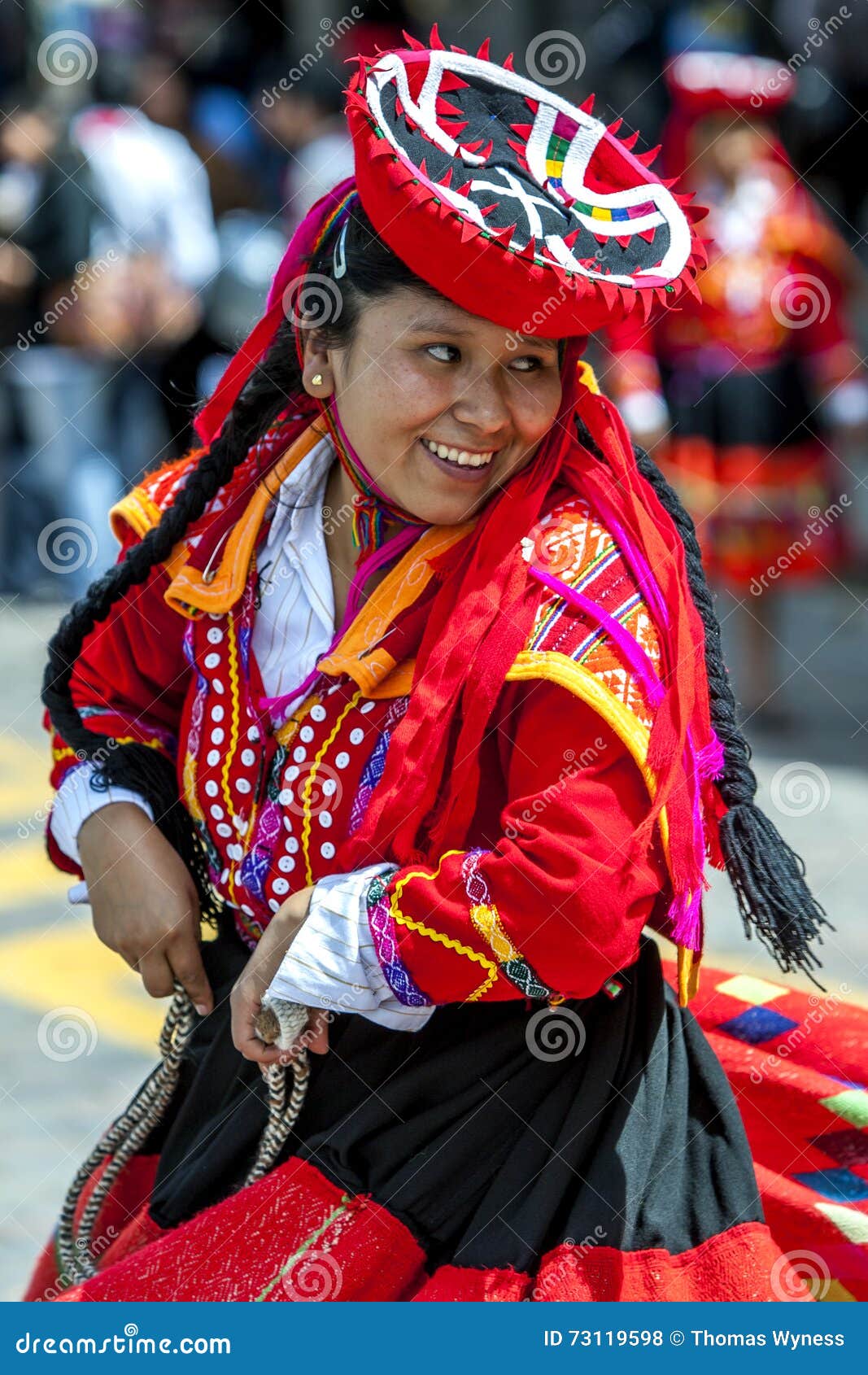 A Colourfully Dressed Performer Dances Down a Cusco Street during the ...