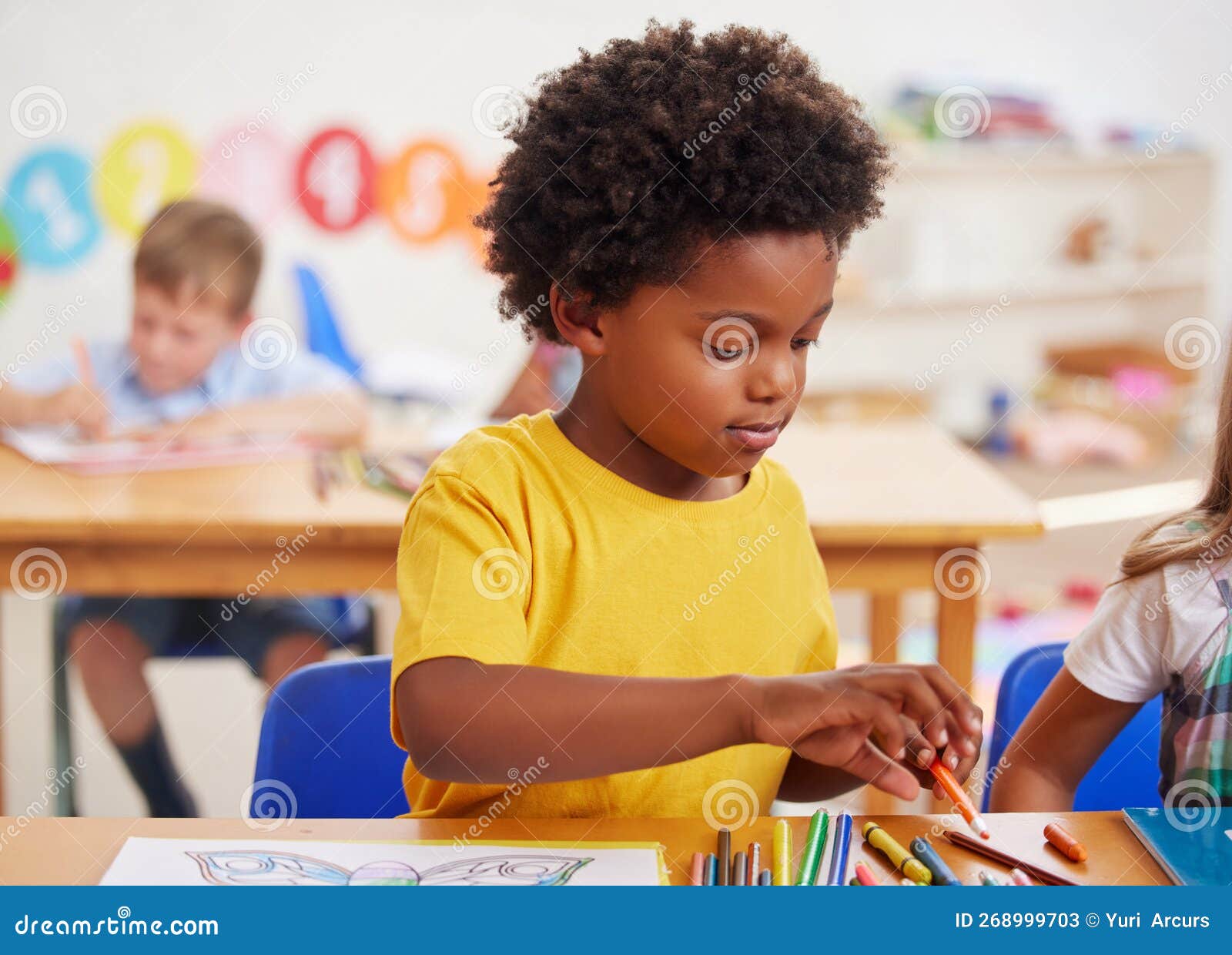 Colouring Promotes Creativity. a Preschooler Colouring in Class. Stock ...