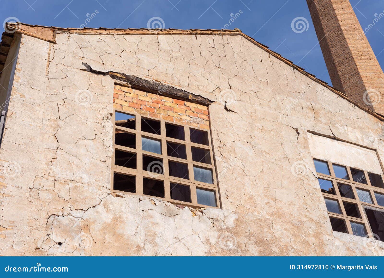 Colseup from Below Windows of an Old Abandoned Gray Paper Mill with a ...