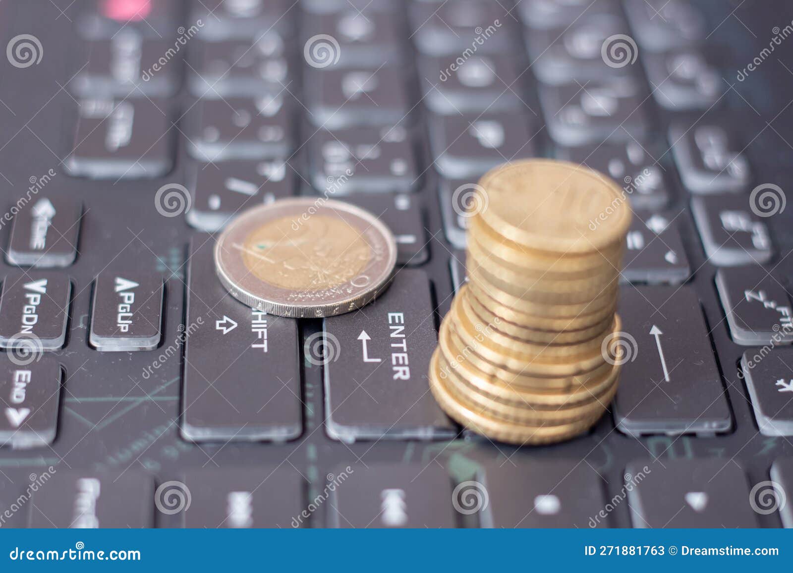 A Column of Coins on a Computer Keyboard. Stock Image - Image of ...