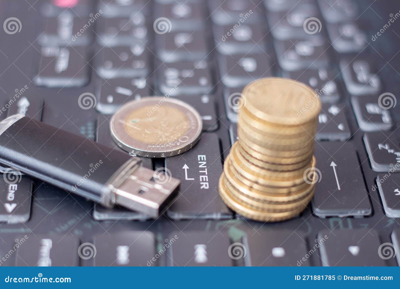 A Column of Coins and a Flash Drive on a Computer Keyboard. Stock Image ...