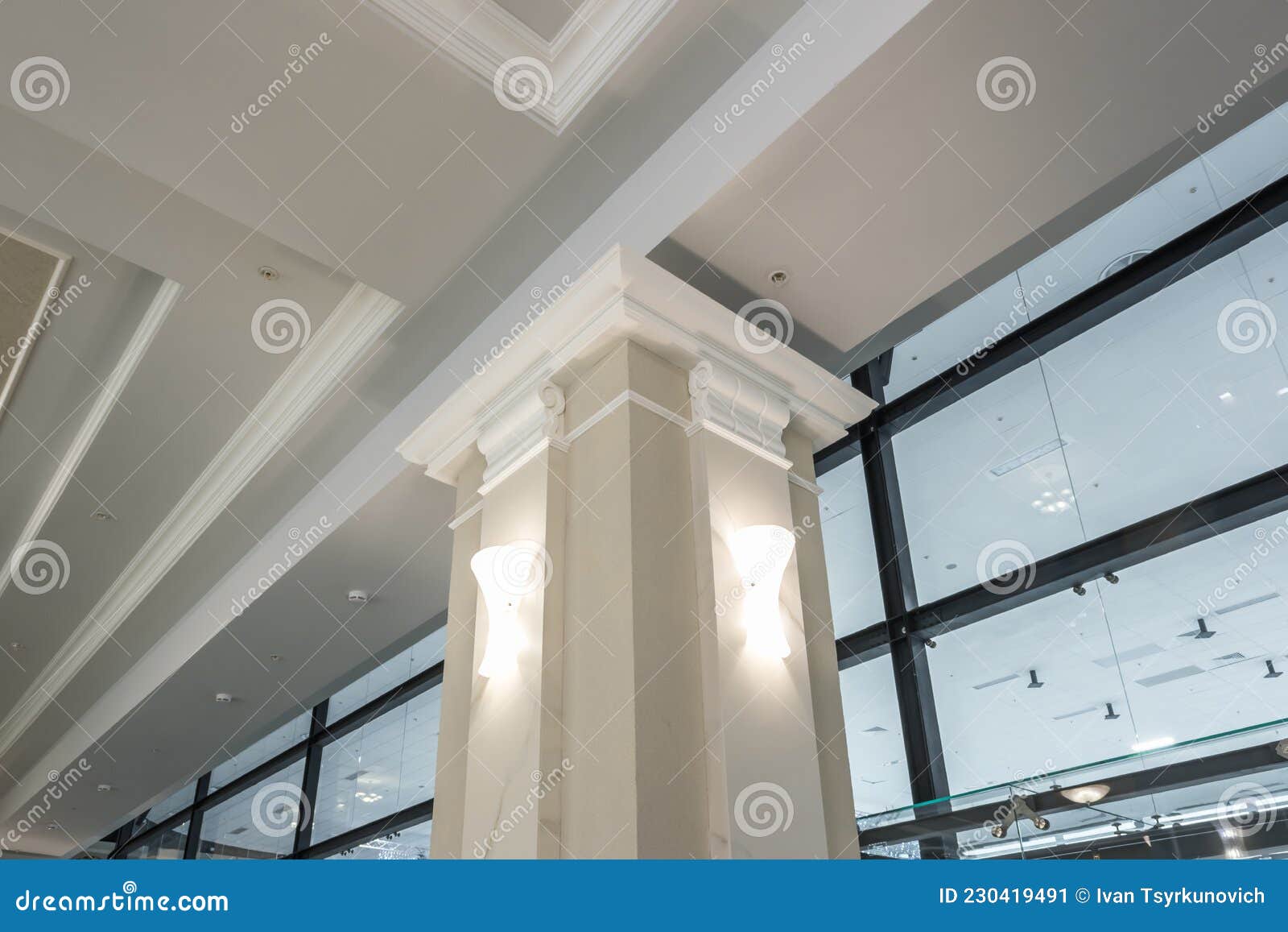 Column in Interior with Suspended and Grid Ceiling with Halogen Spots ...