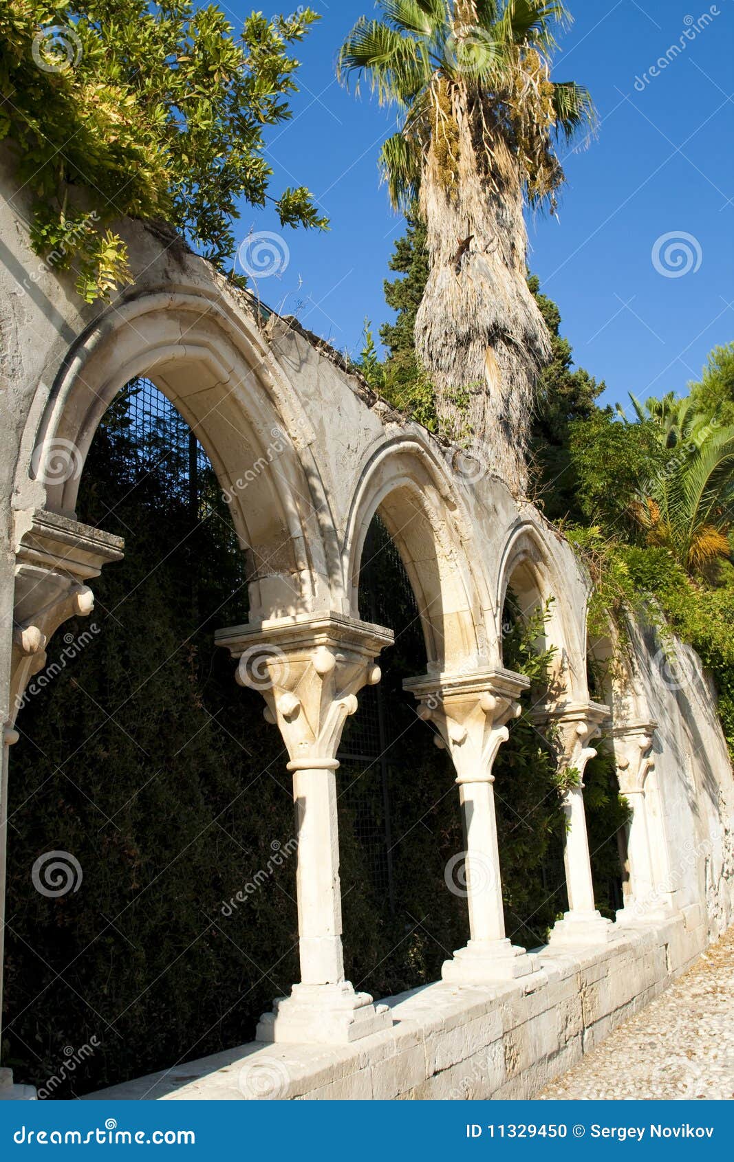 Columns and Arch with Palms Stock Photo - Image of italian, monument ...