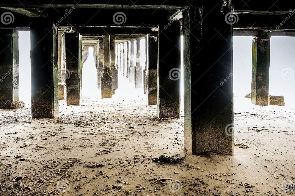 Columns of a Bridge on a Beach Stock Image - Image of architecture ...