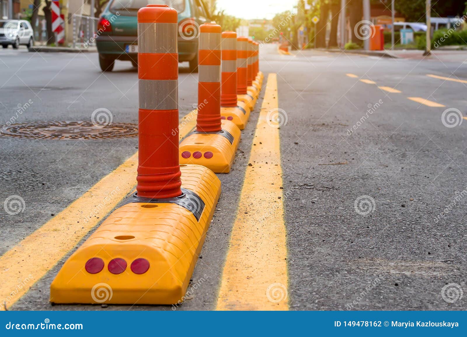 Columns with a Reflective Layer and Yellow Road Marking Separates the ...