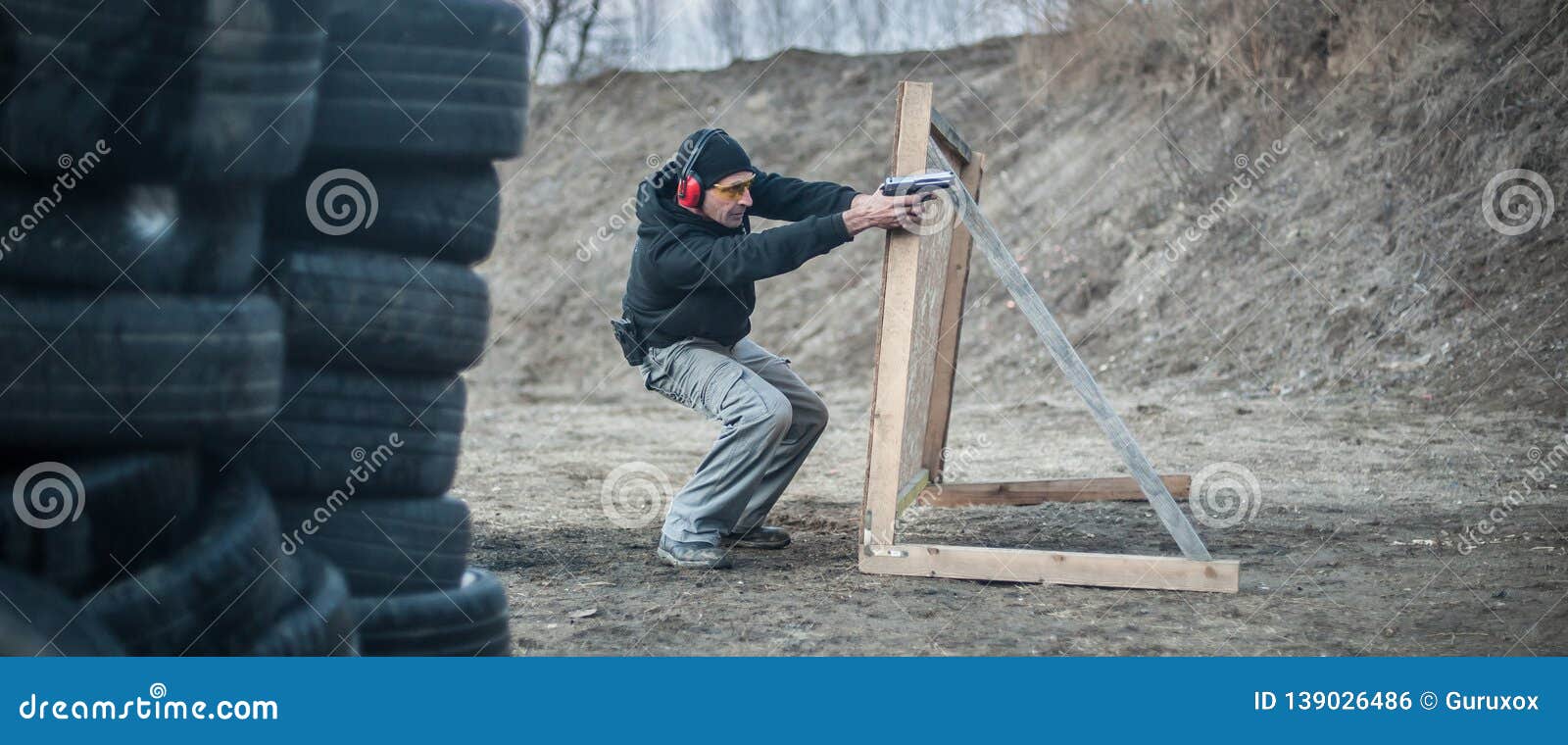 Combat Gun Tactical Shooting Behind and Around Cover or Barricade Stock ...