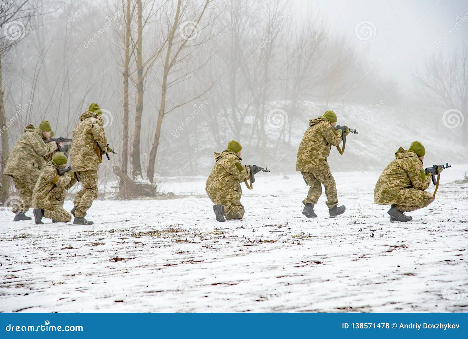 A Combat Squad in Camouflage with a Weapon Goes on the Offensive in ...