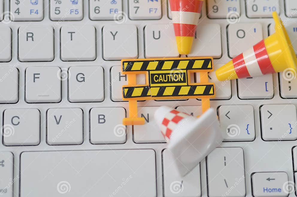 The Combination of the Construction Cones and the Keyboard Suggests a ...