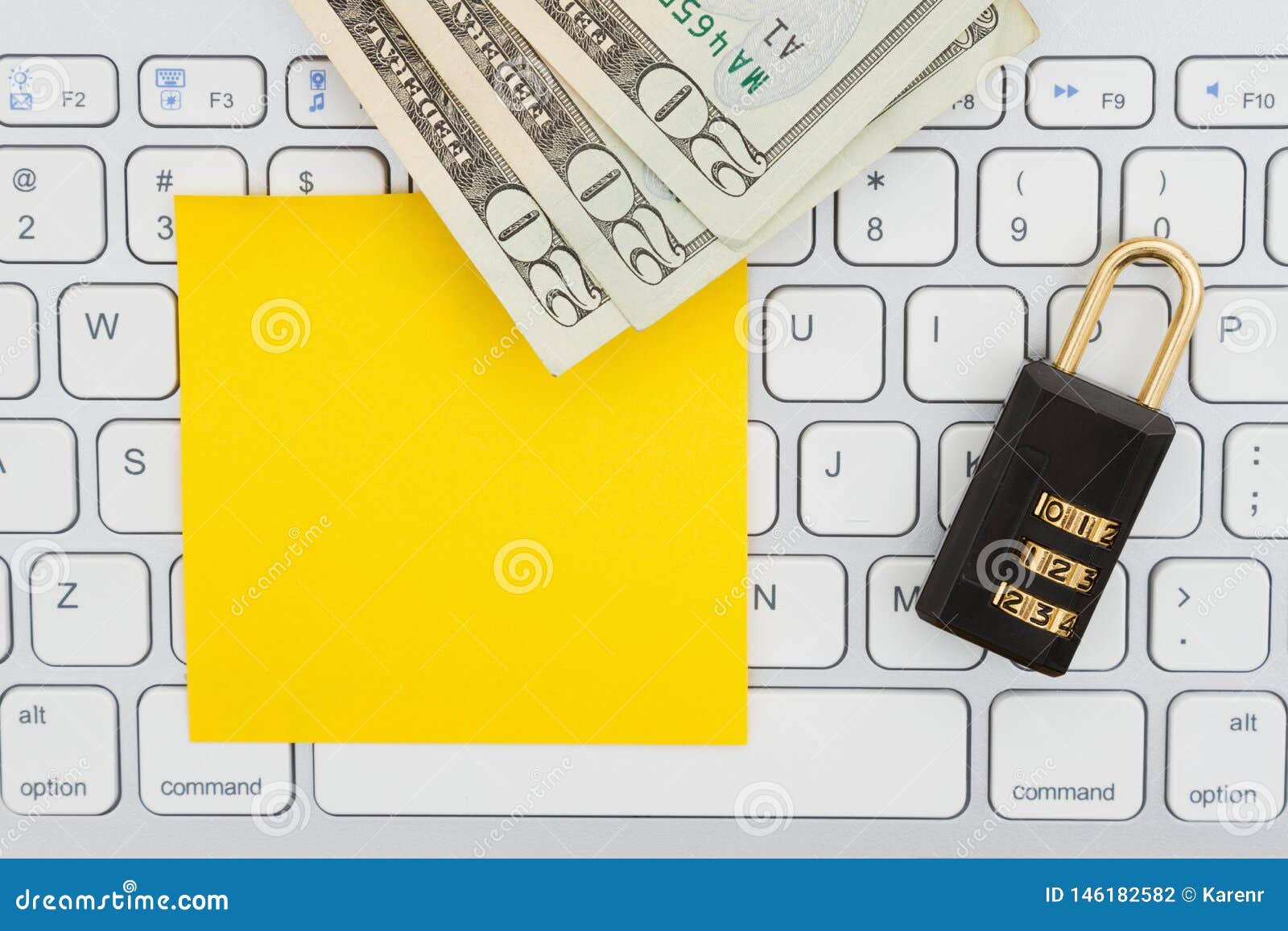 Combination Lock and Money on a Keyboard with Sticky Note Stock Photo ...