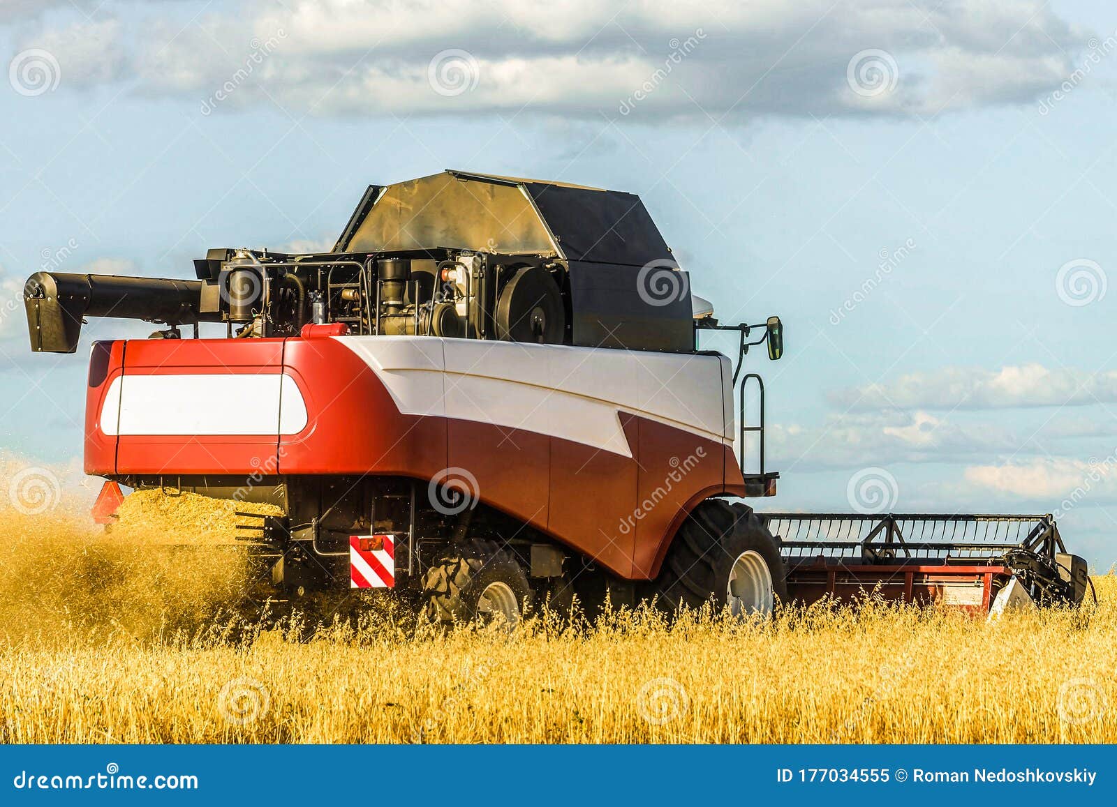 Combine Harvester with Ñ utter Platform at Work. Reaping Machine Stock ...