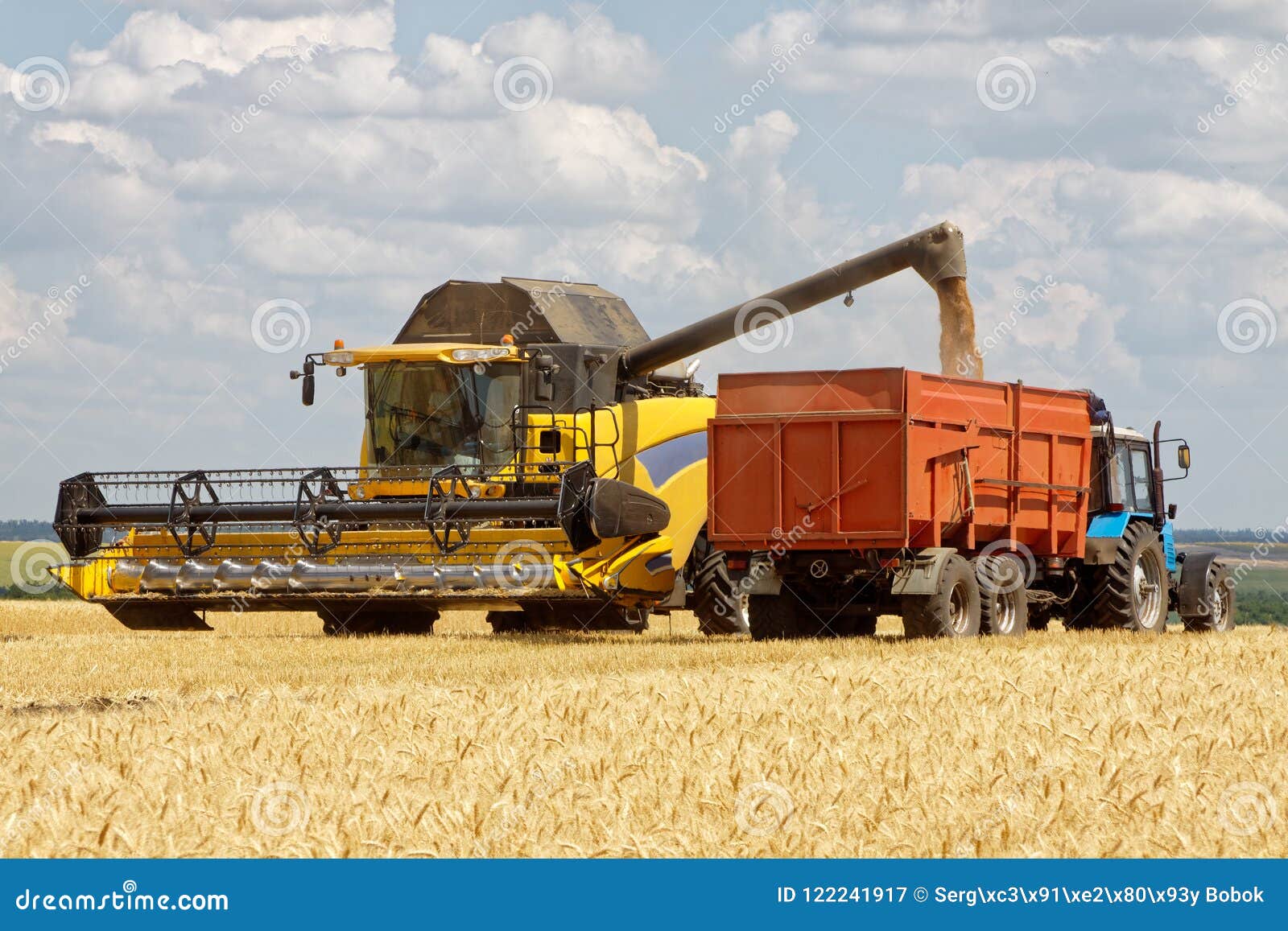 Combine Harvester Load Wheat in the Truck Stock Image - Image of earth ... Combine Harvester Load Wheat in the Truck Stock Image - Image of earth ...