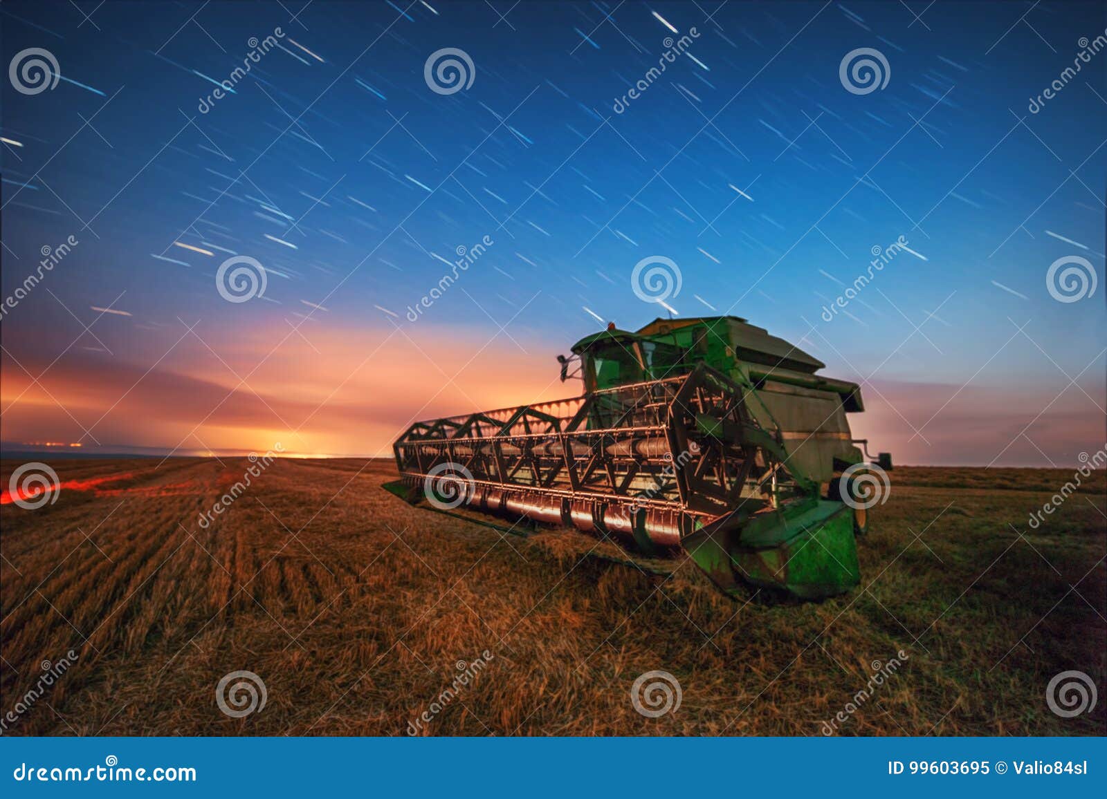 Combine Harvester Machine Working in a Wheat Field, Sunset and S Stock ...
