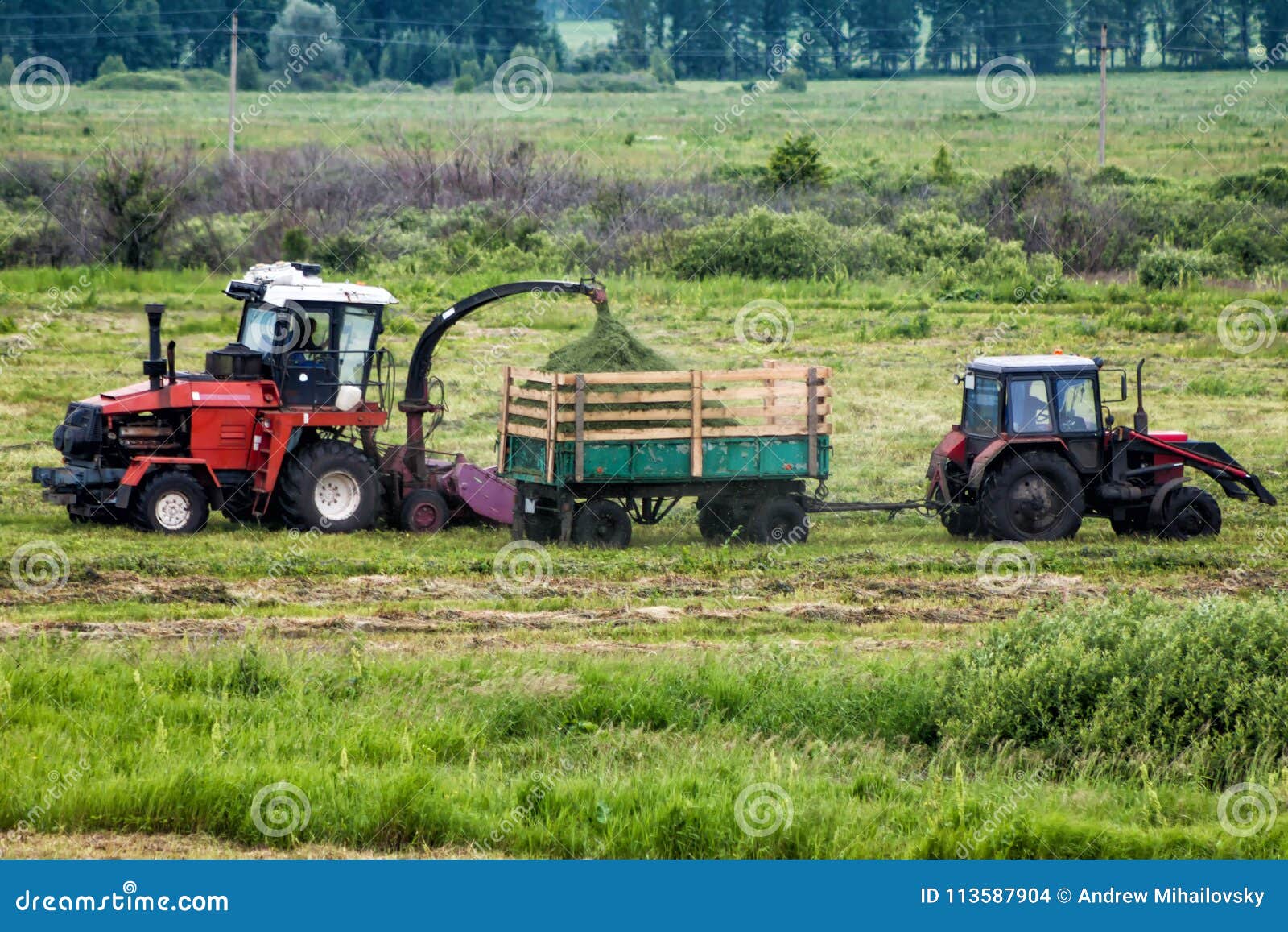 Combine Harvester and Tractor Remove Grass Stock Photo - Image of ...