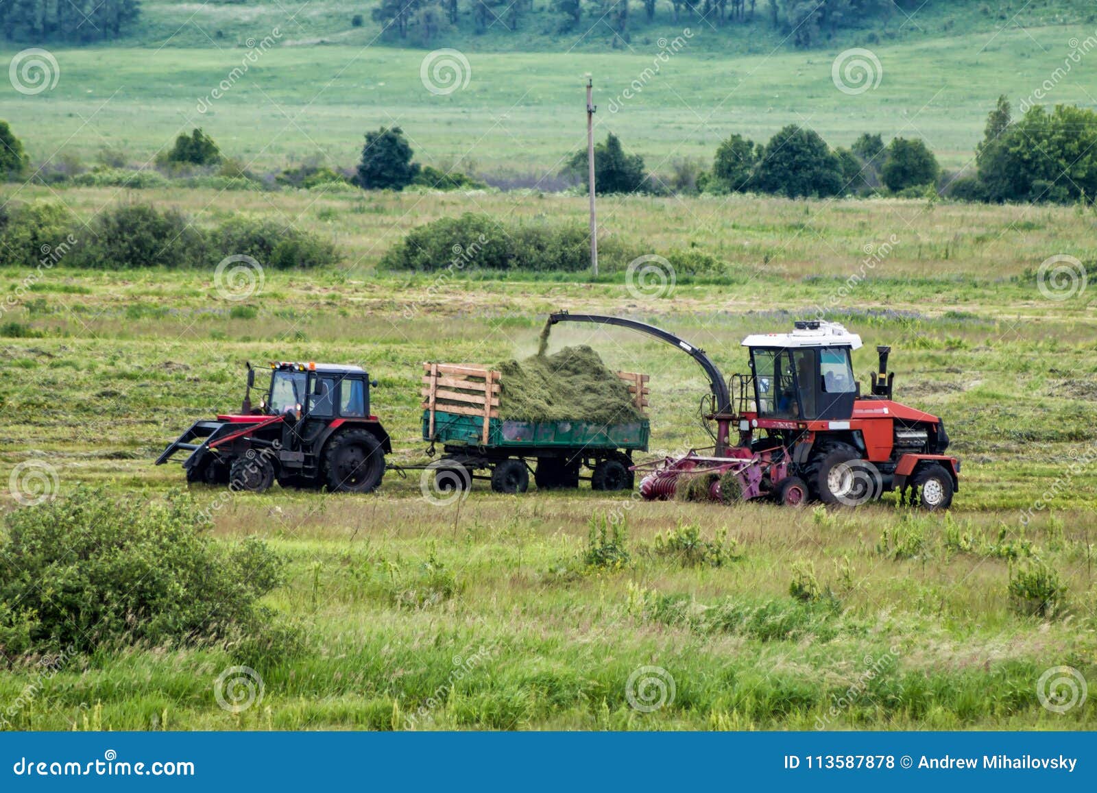 Combine Harvester and Tractor Remove Grass Stock Photo - Image of ...