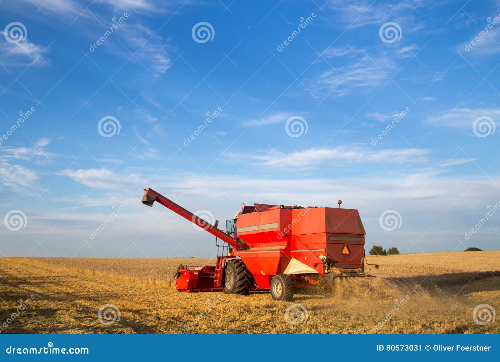 Combine harvester at work stock image. Image of outdoors - 80573031