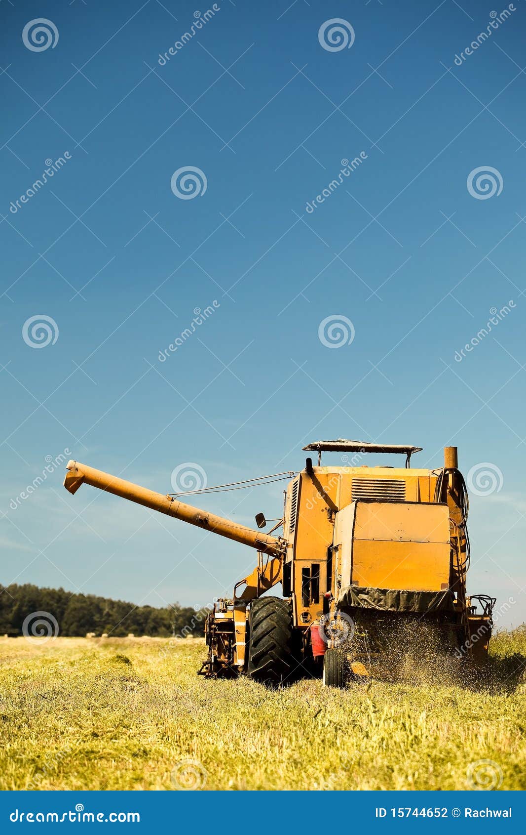 Combine harvester working stock photo. Image of wheat - 15744652