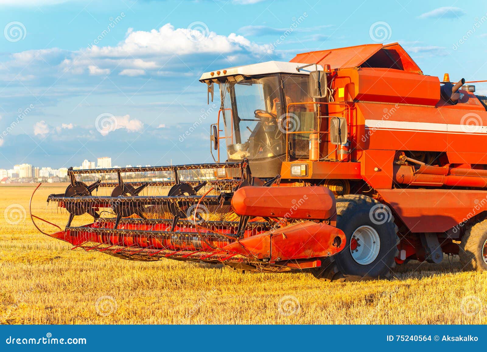 Combine harvester working stock photo. Image of golden - 75240564
