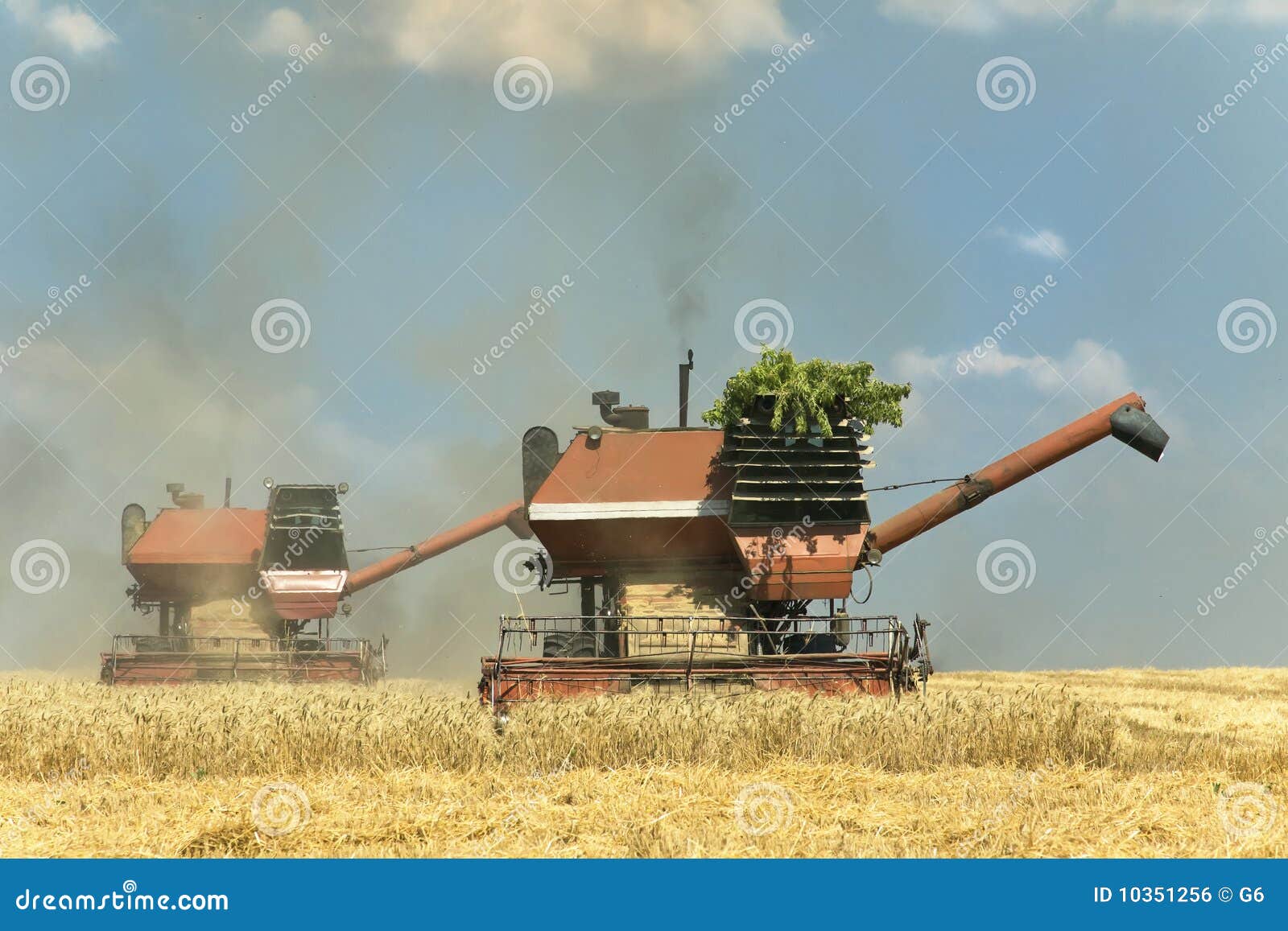Combine harvesters at work stock photo. Image of transport - 10351256