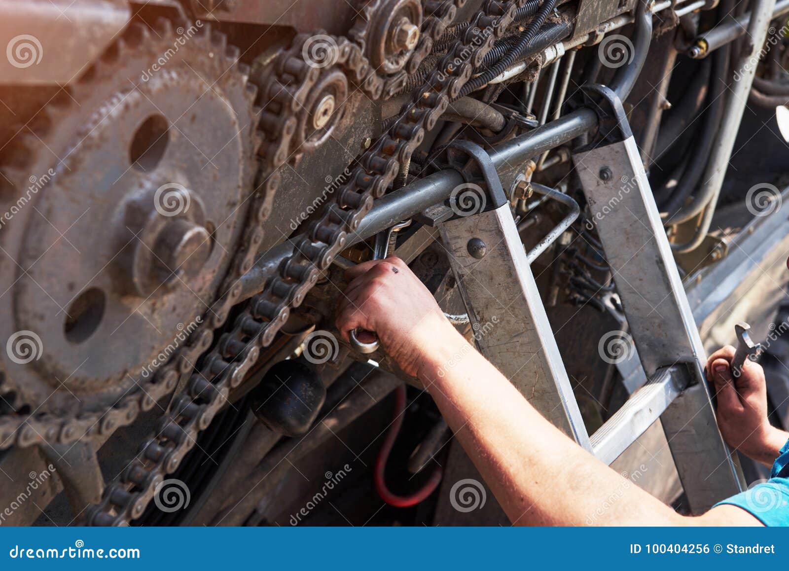 Combine Machine Service, Mechanic Repairing Motor Outdoors Stock Photo ...