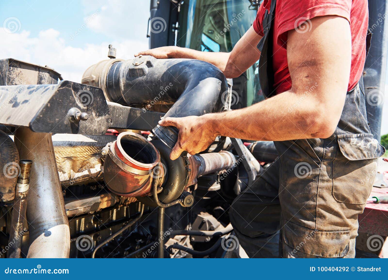 Combine Machine Service, Mechanic Repairing Motor Outdoors Stock Photo ...