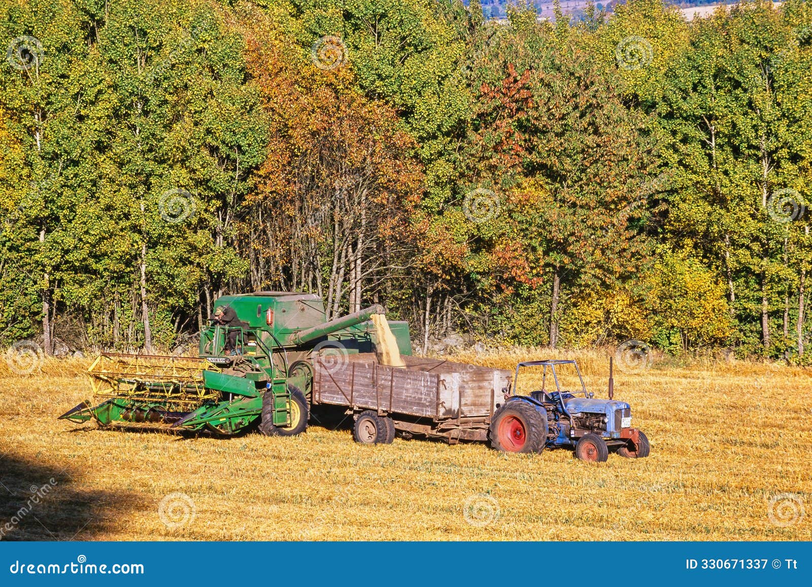 Combine Unloading Grain into a Cart on a Field Stock Image - Image of ...