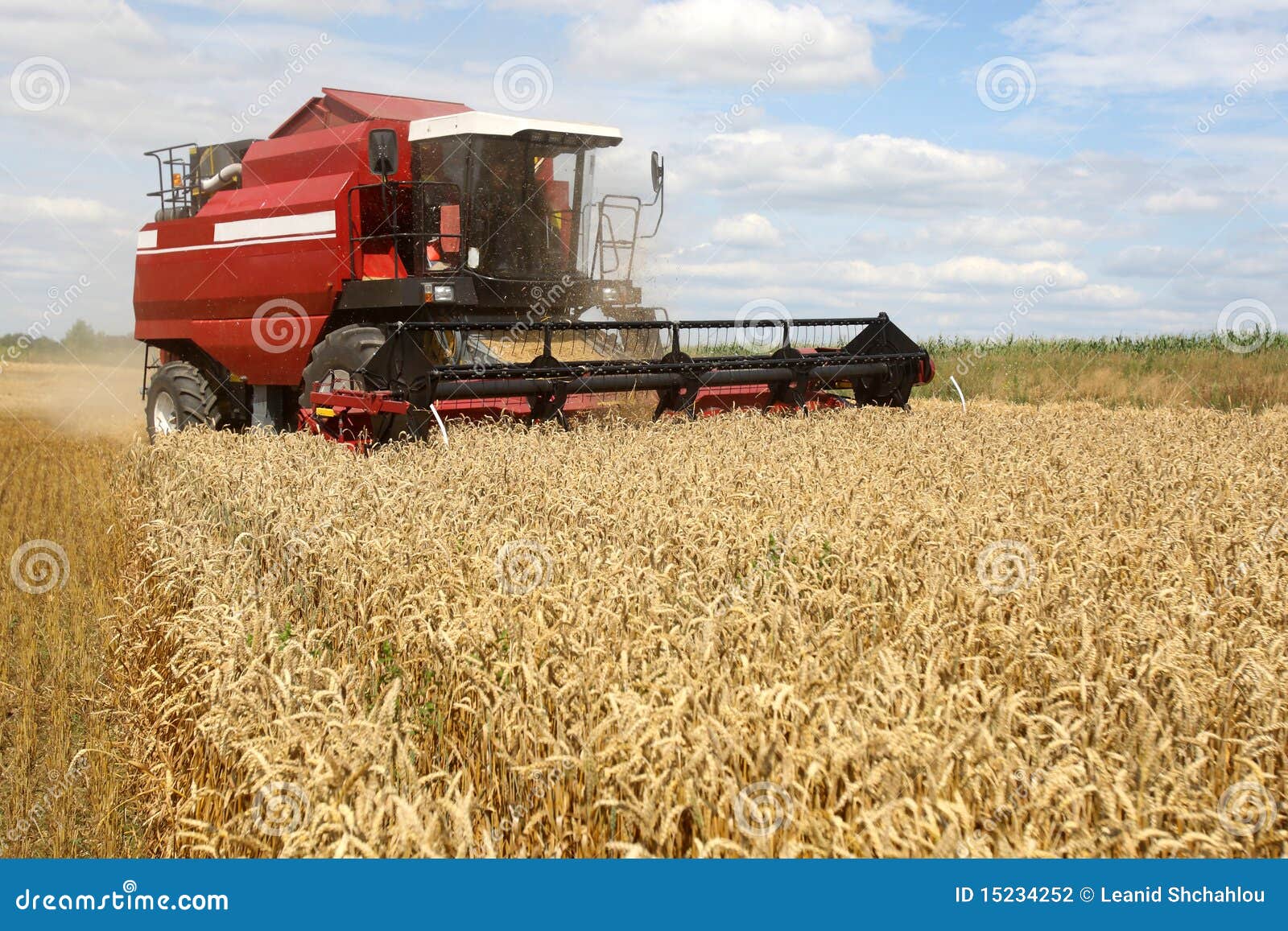 Combine Working on a Wheat Field Stock Photo - Image of cloud, yellow ...